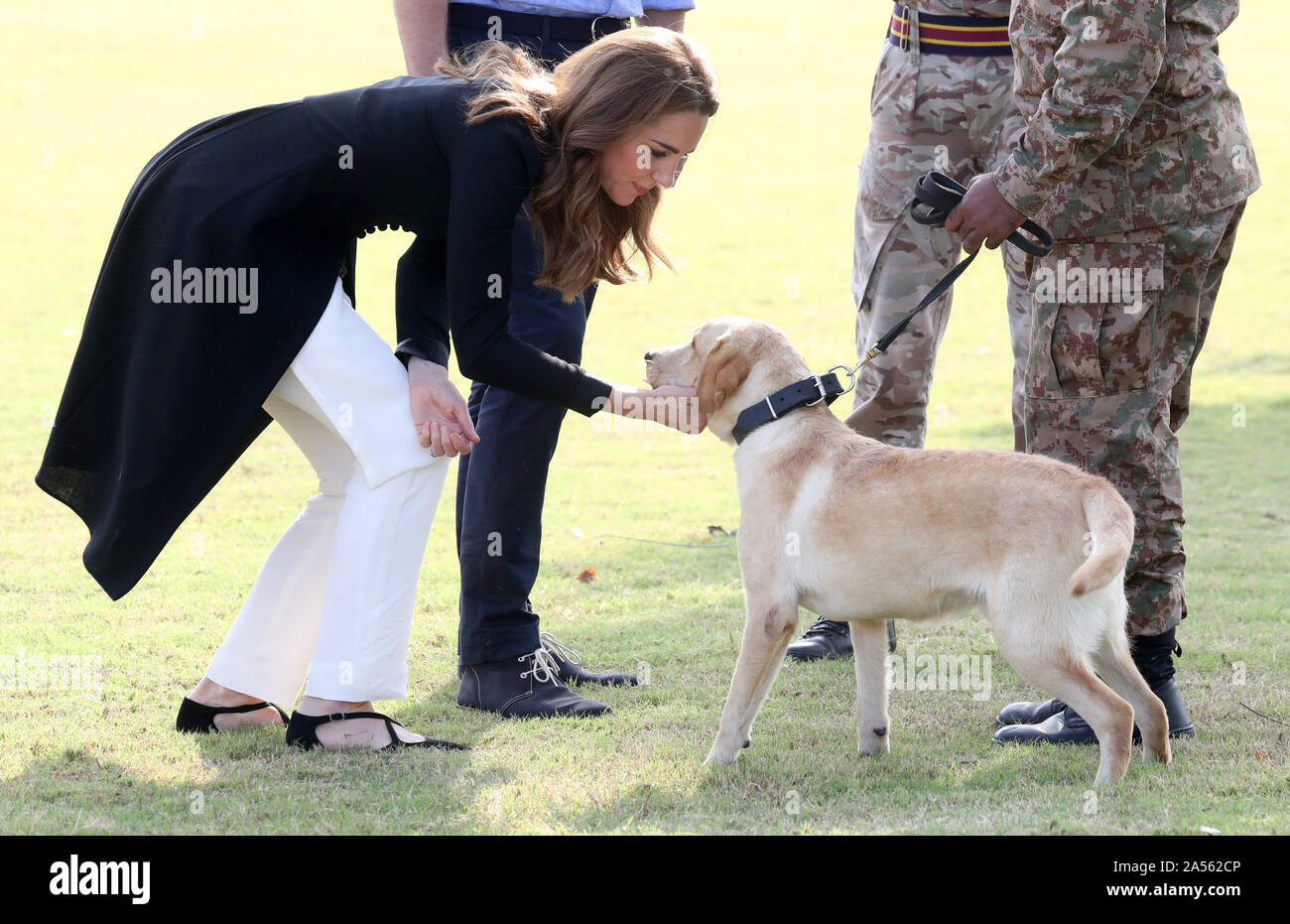 The Duchess of Cambridge with golden labrador Polka during a visit to ...