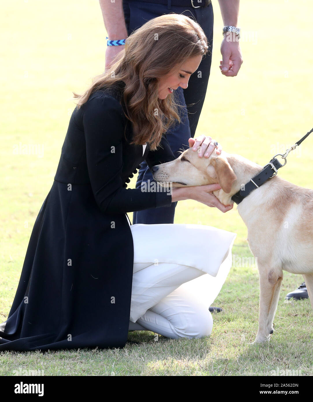The Duchess of Cambridge with golden labrador Polka during a visit to ...