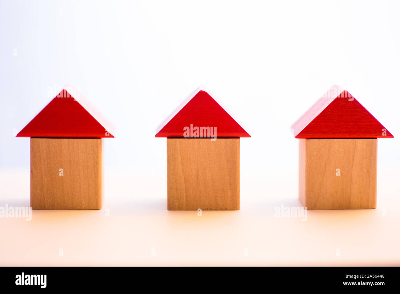 three wooden block houses abreast Stock Photo - Alamy