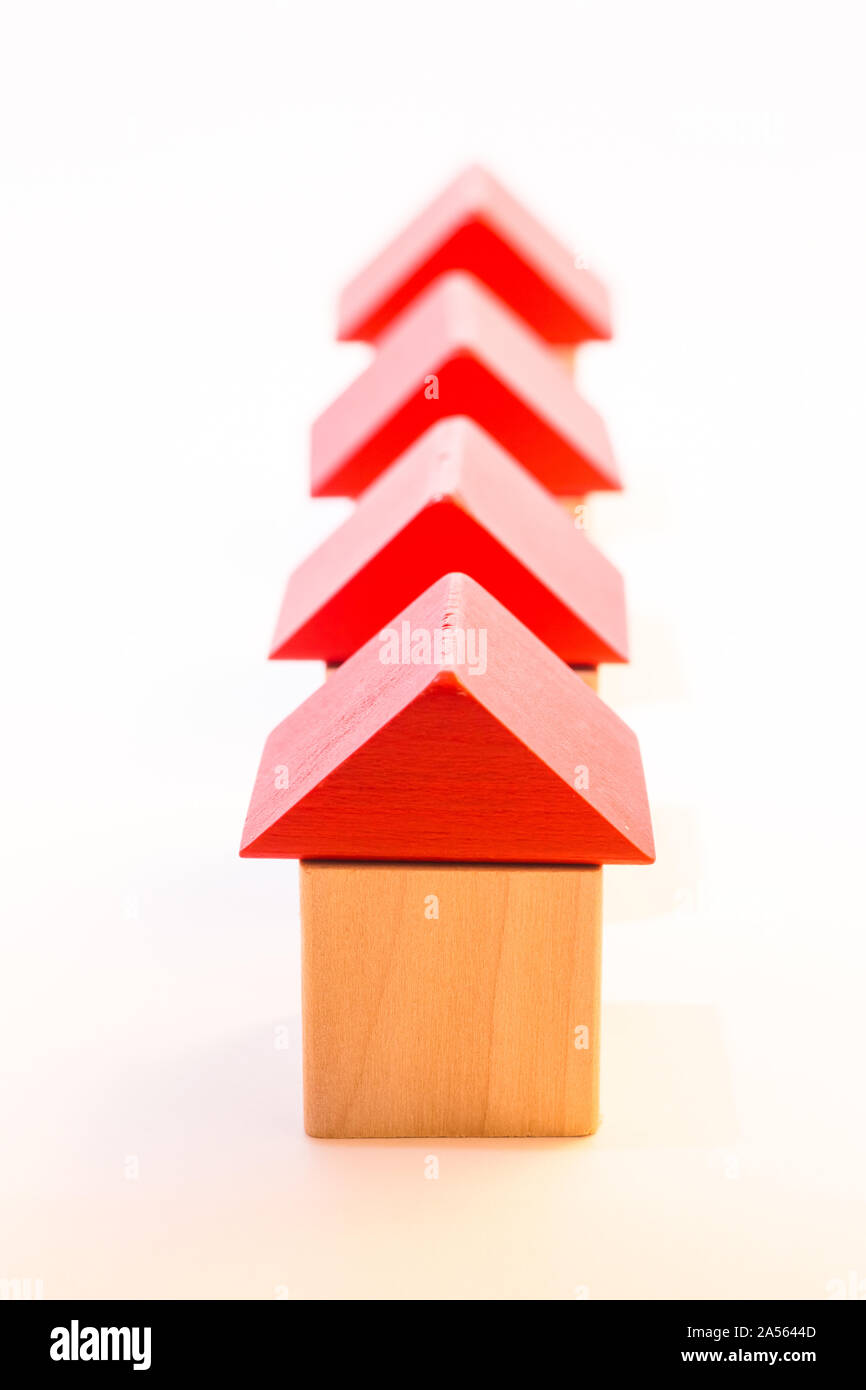 four wooden block houses consecutively Stock Photo - Alamy