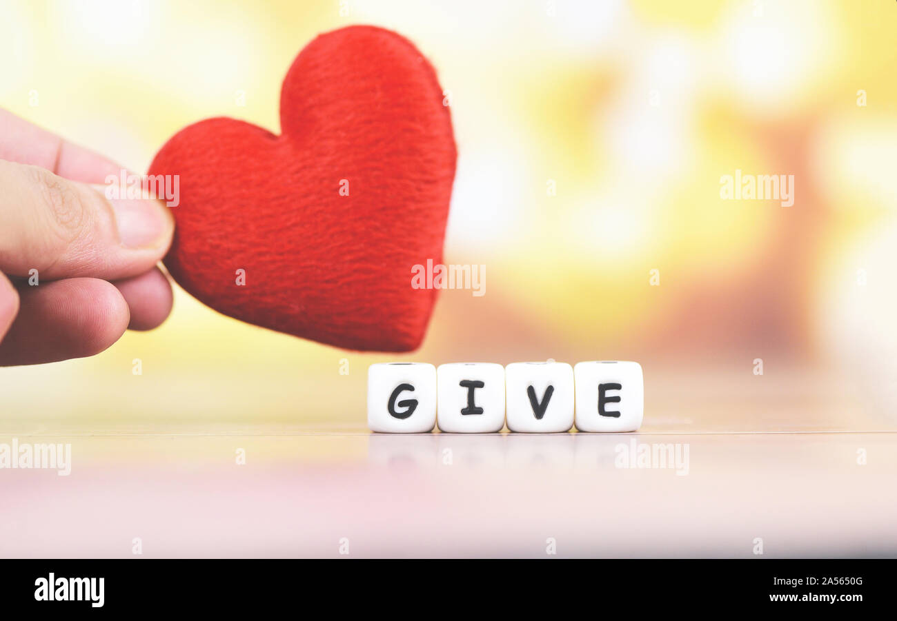 Give love with red heart in hand for donate and philanthropy health ...
