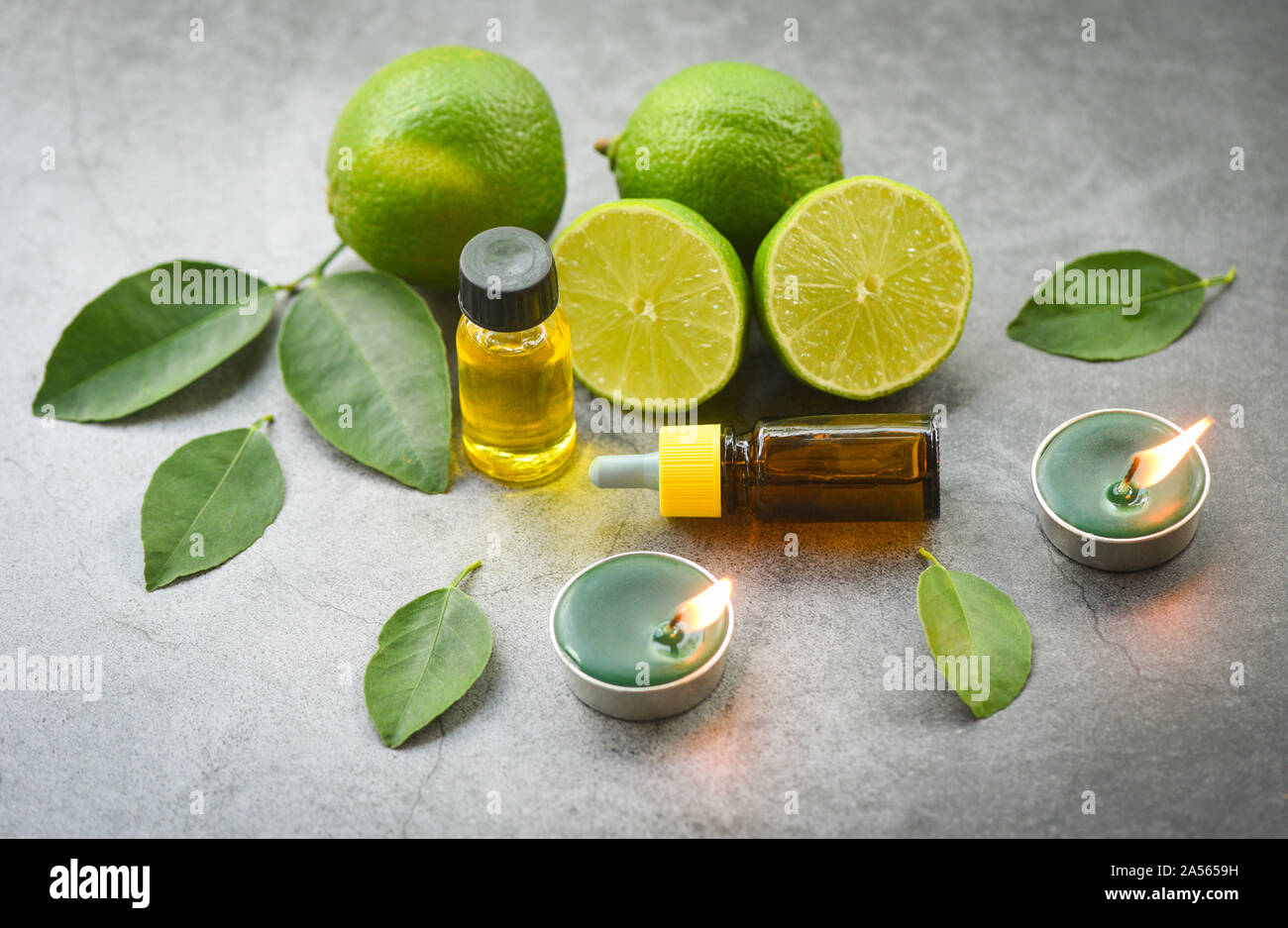 Aromatherapy herbal oil bottles aroma with lime lemon leaves herbal ...