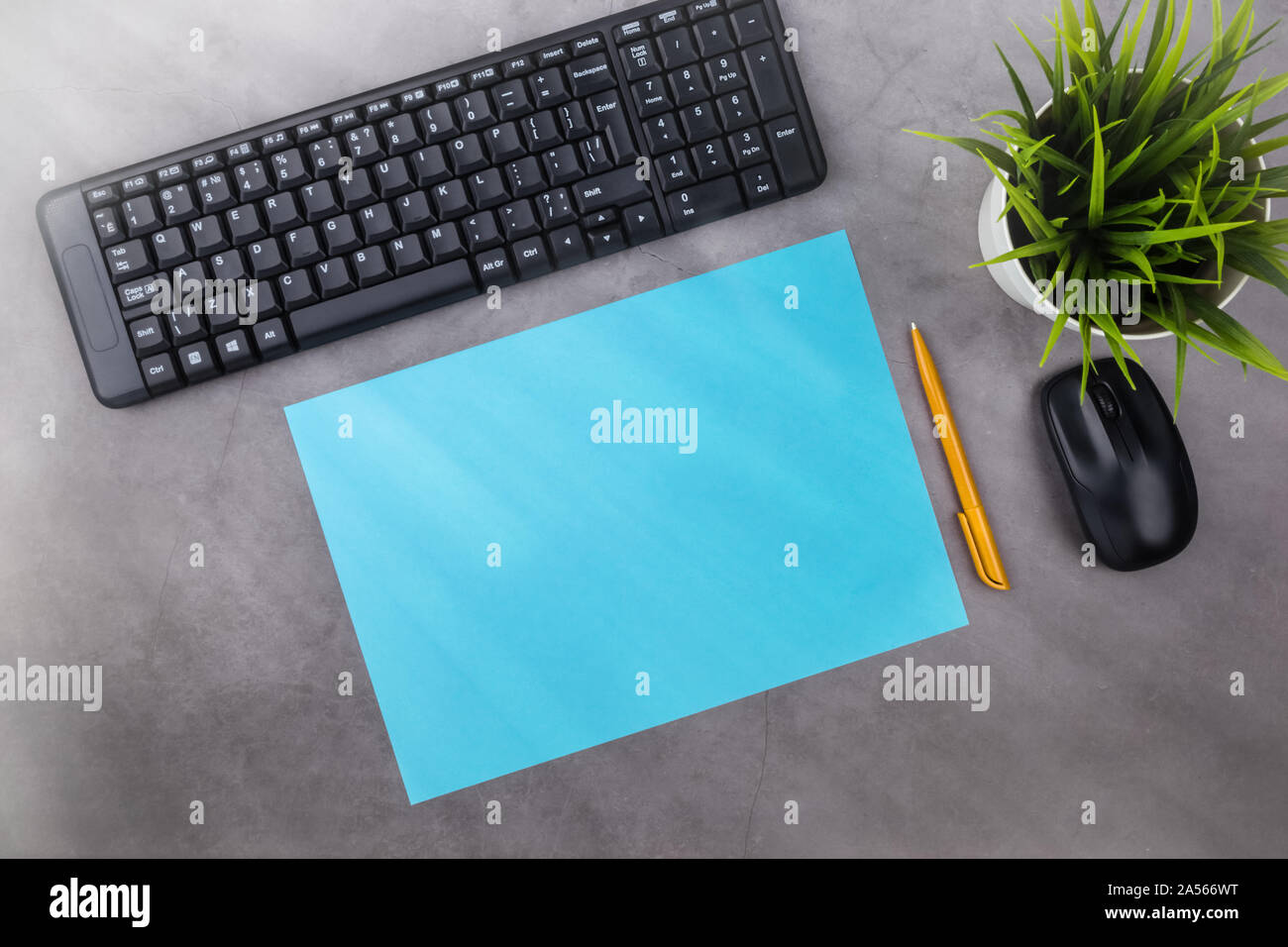 Working place on dark table with copy space. Keyboard, computer mouse ...