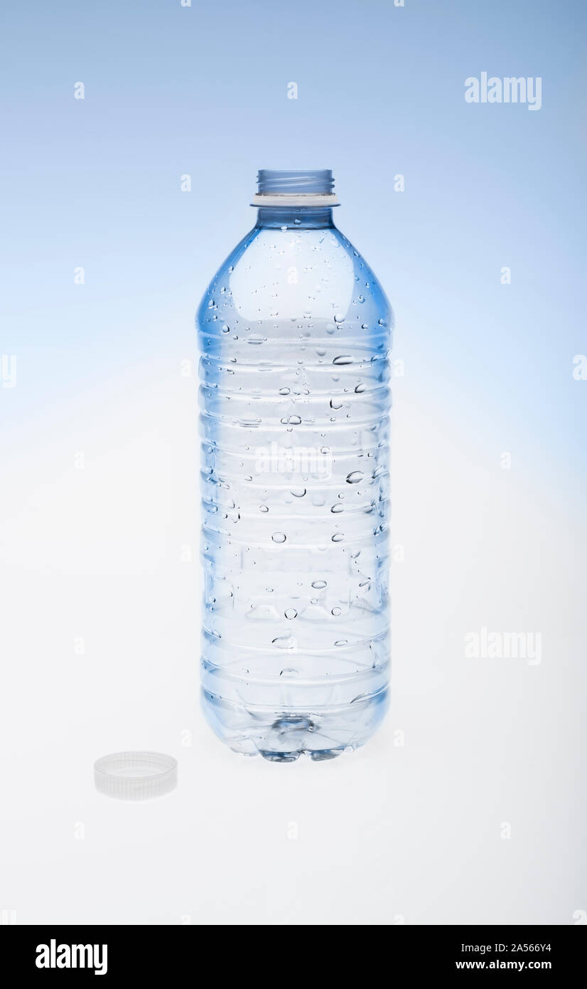 Empty water bottle with cap to the side Stock Photo - Alamy