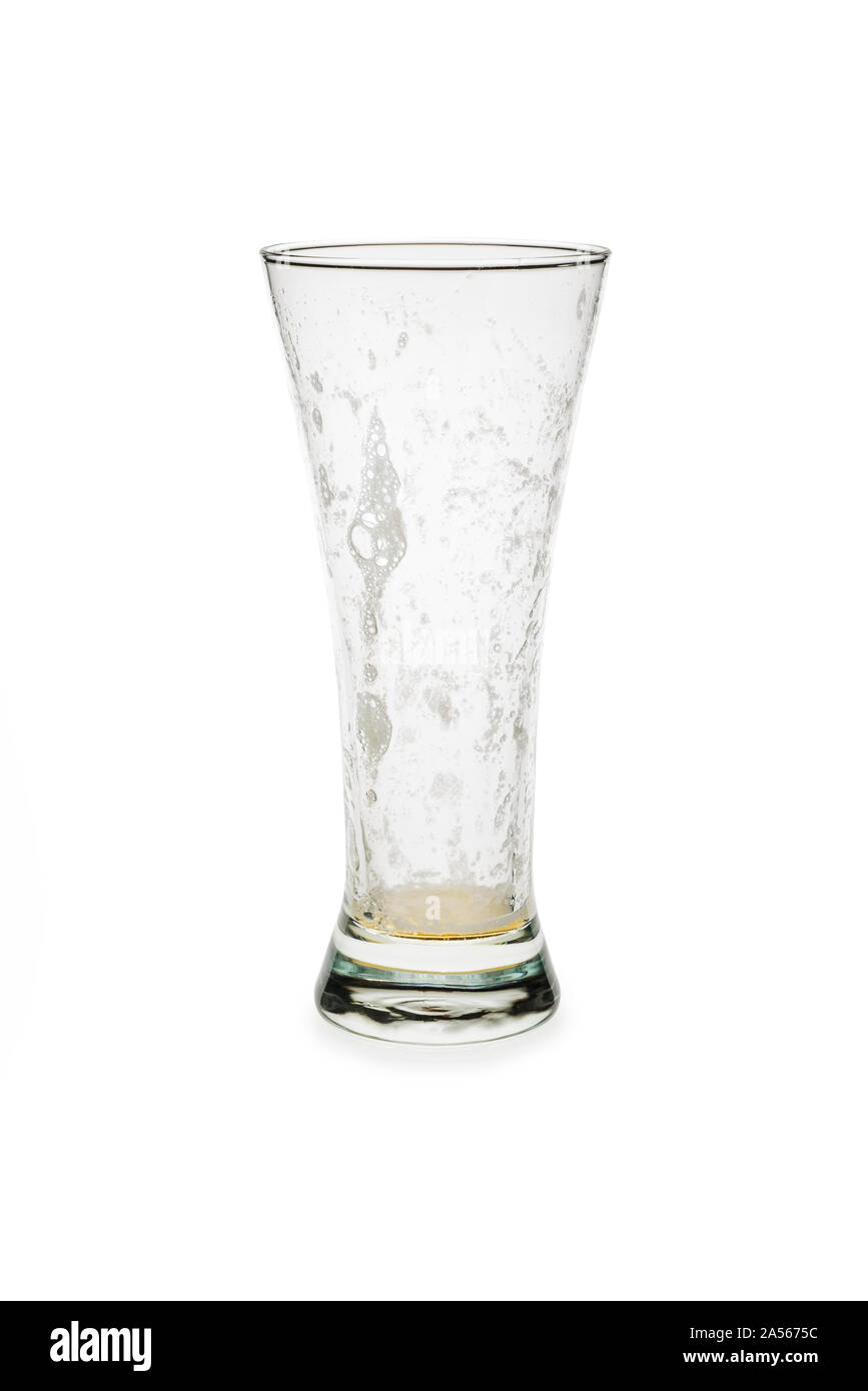 Empty pilsner glass isolated against white background. glass with foam ...