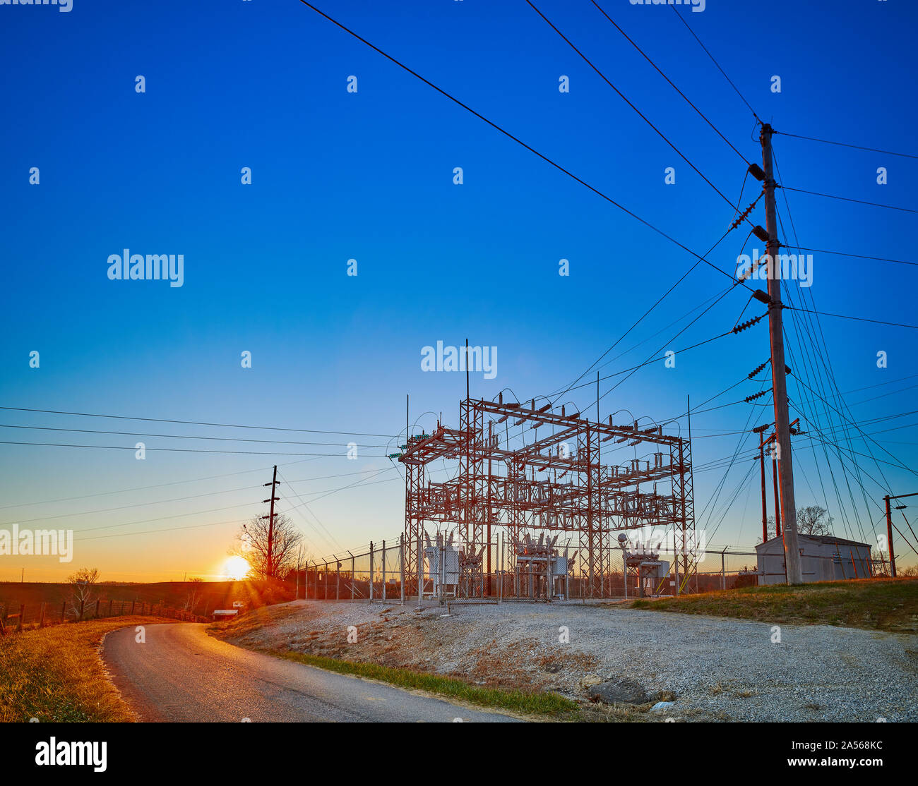 Electric substation at sunset with blue sky Stock Photo - Alamy
