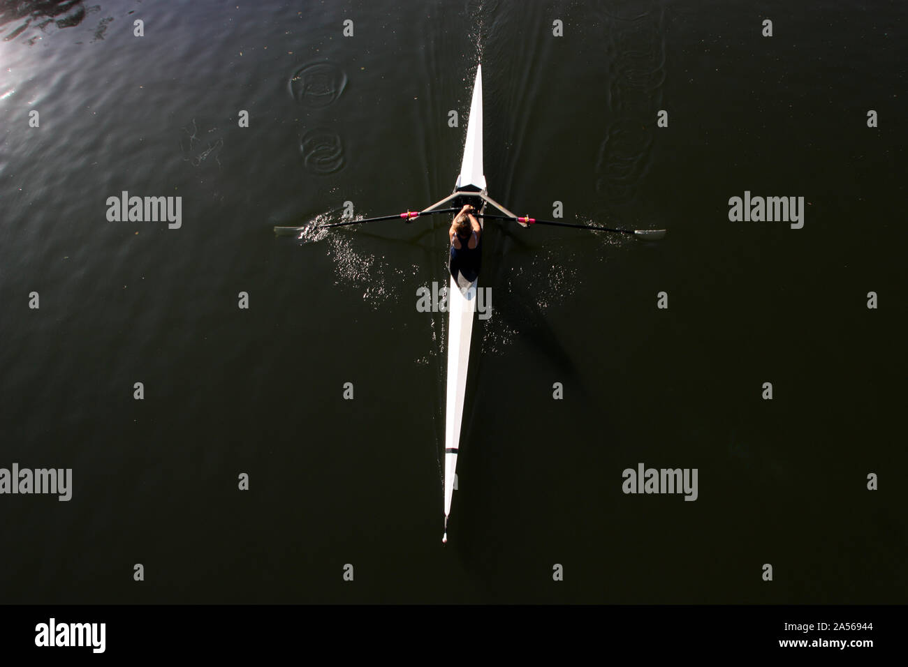 Aerial view of a rower rowing a single skull in Oxford on the Thames ...