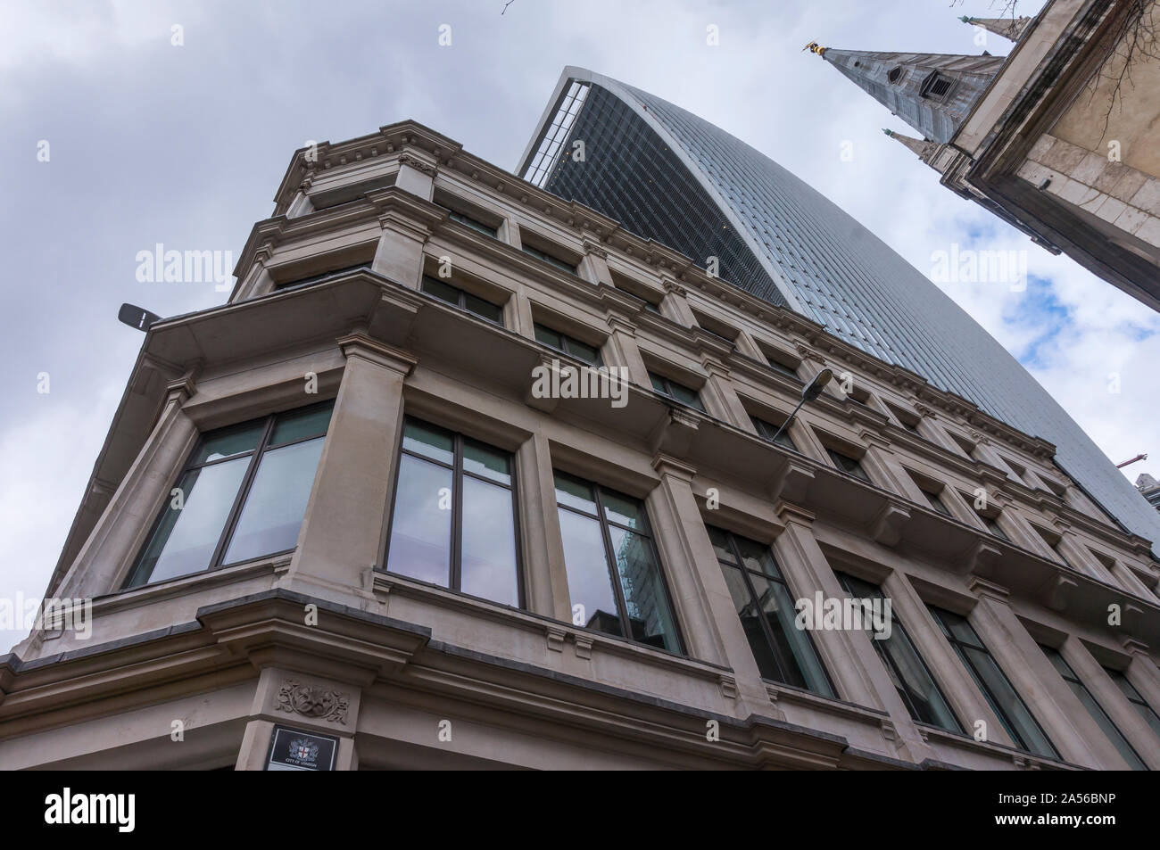 Fantastic classic architecture in City of London with skyscrapers in ...