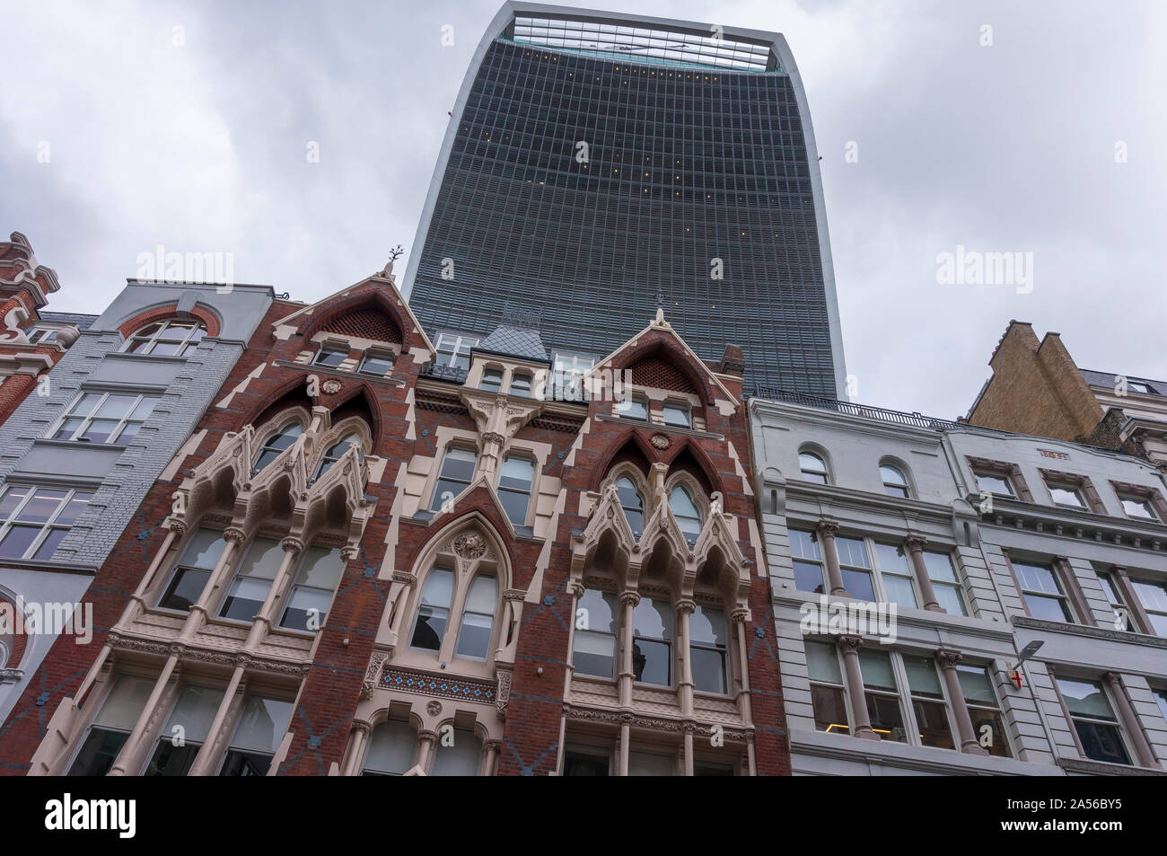 Fantastic classic architecture in City of London with skyscrapers in ...
