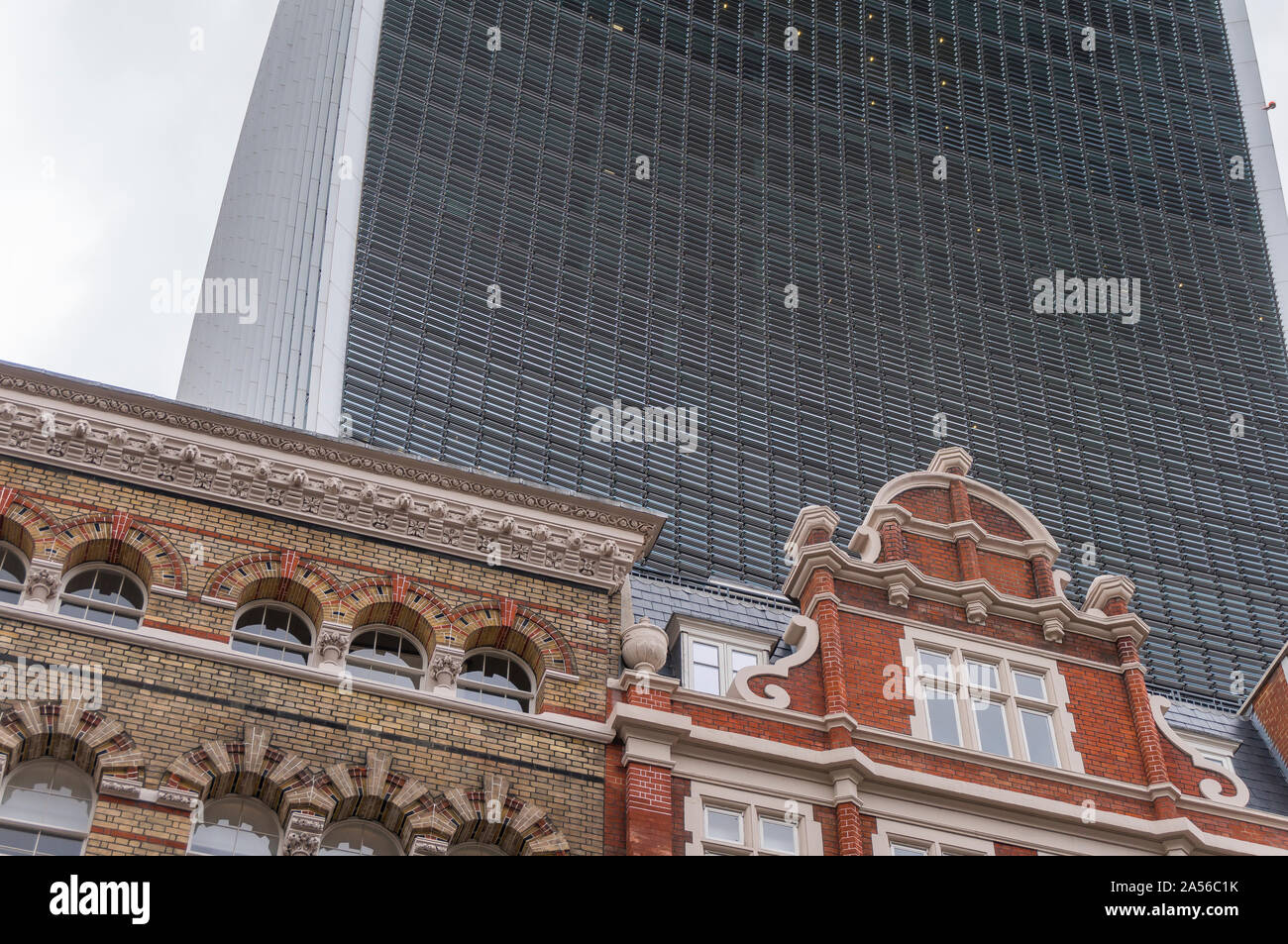 Fantastic classic architecture in City of London with skyscrapers in ...
