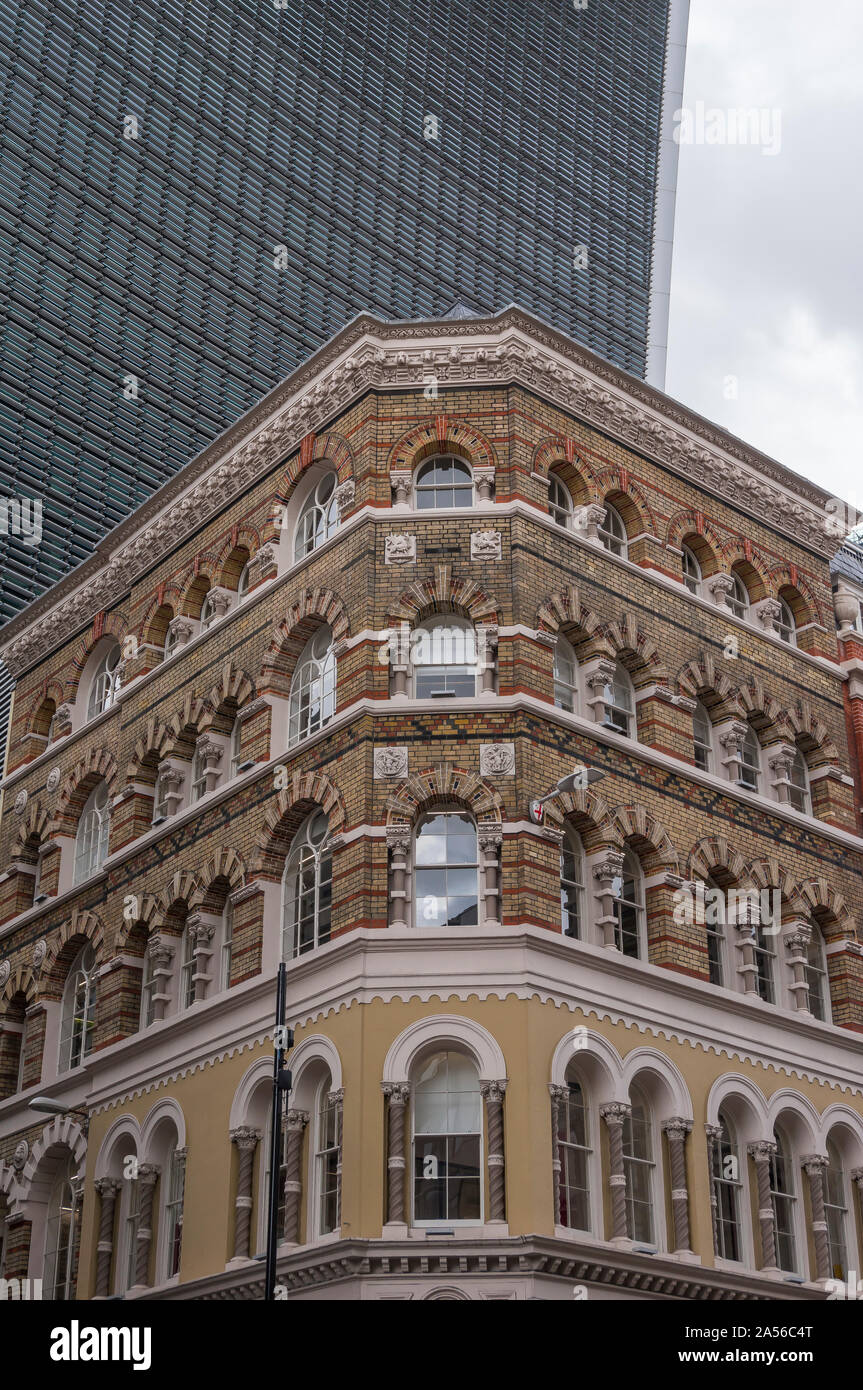 Fantastic classic architecture in City of London with skyscrapers in ...