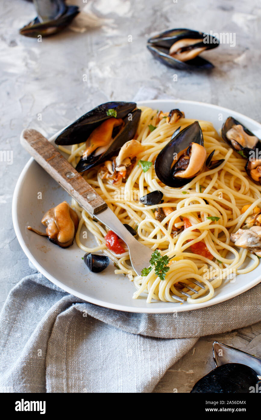 Spaghetti with mussels and tomatoes italian seafood pasta close up ...