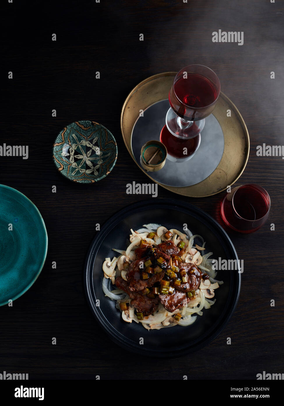 Rustic low key still life with bowl of grilled beef fillet, bitter ...