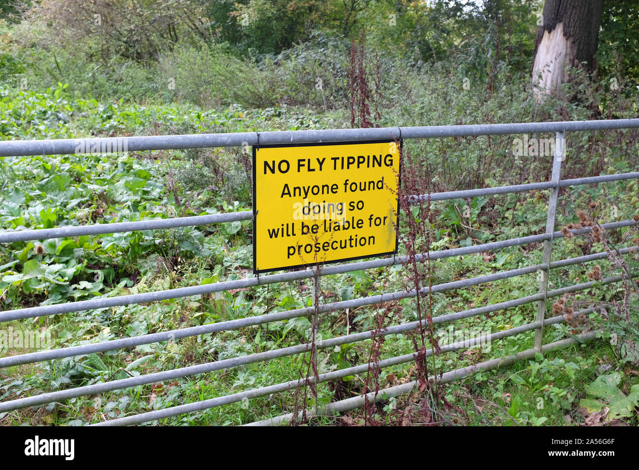 A sign in England warning people against fly tipping Stock Photo - Alamy