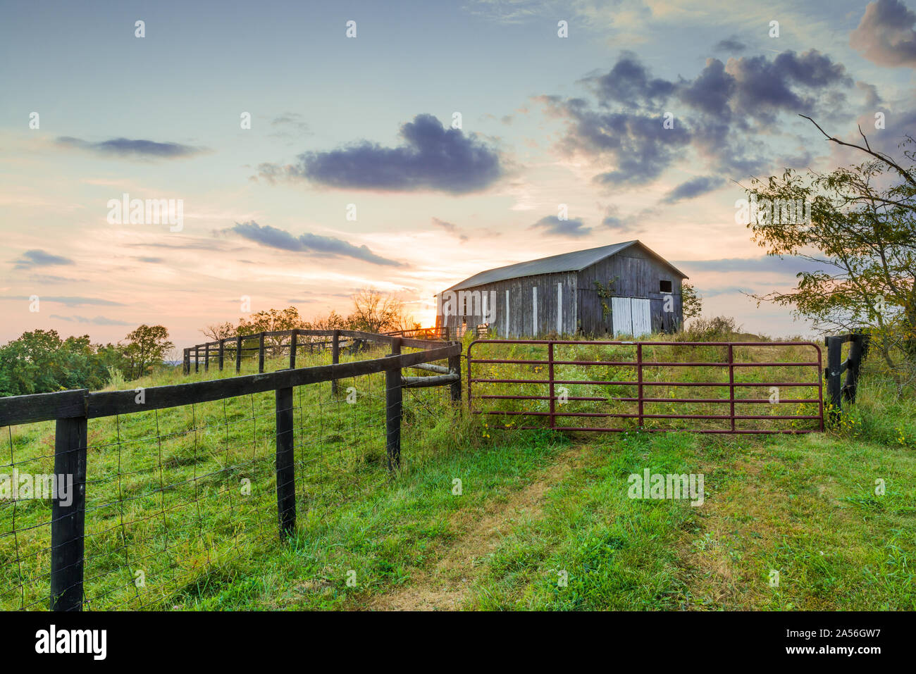 Sunset with Barn Stock Photo - Alamy