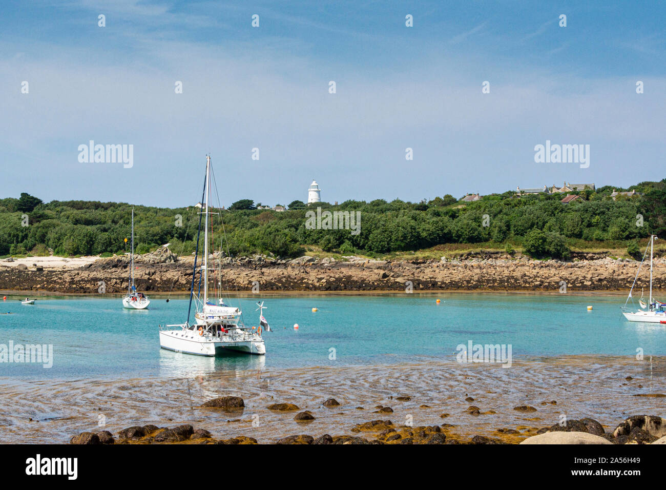 Boats at anchor in The Cove between St Agnes and Gugh, Isles of Scilly ...