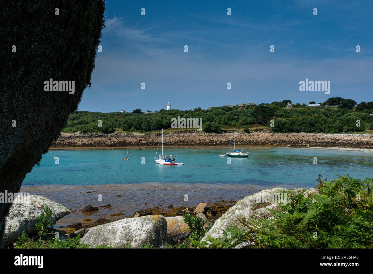Boats at anchor in The Cove between St Agnes and Gugh, Isles of Scilly ...
