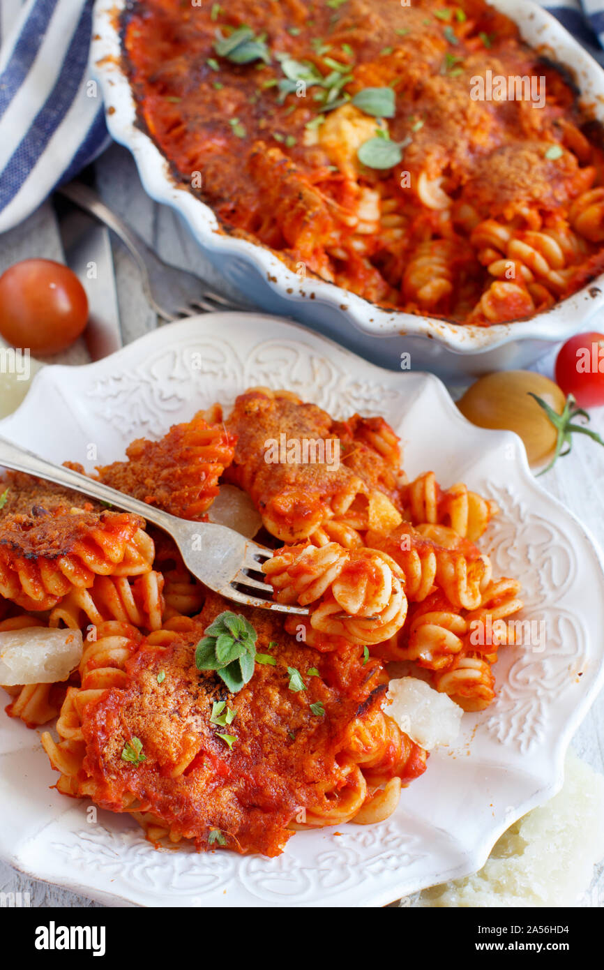 Baked fusilli pasta with tomato sauce and mozzarella cheese Stock Photo ...
