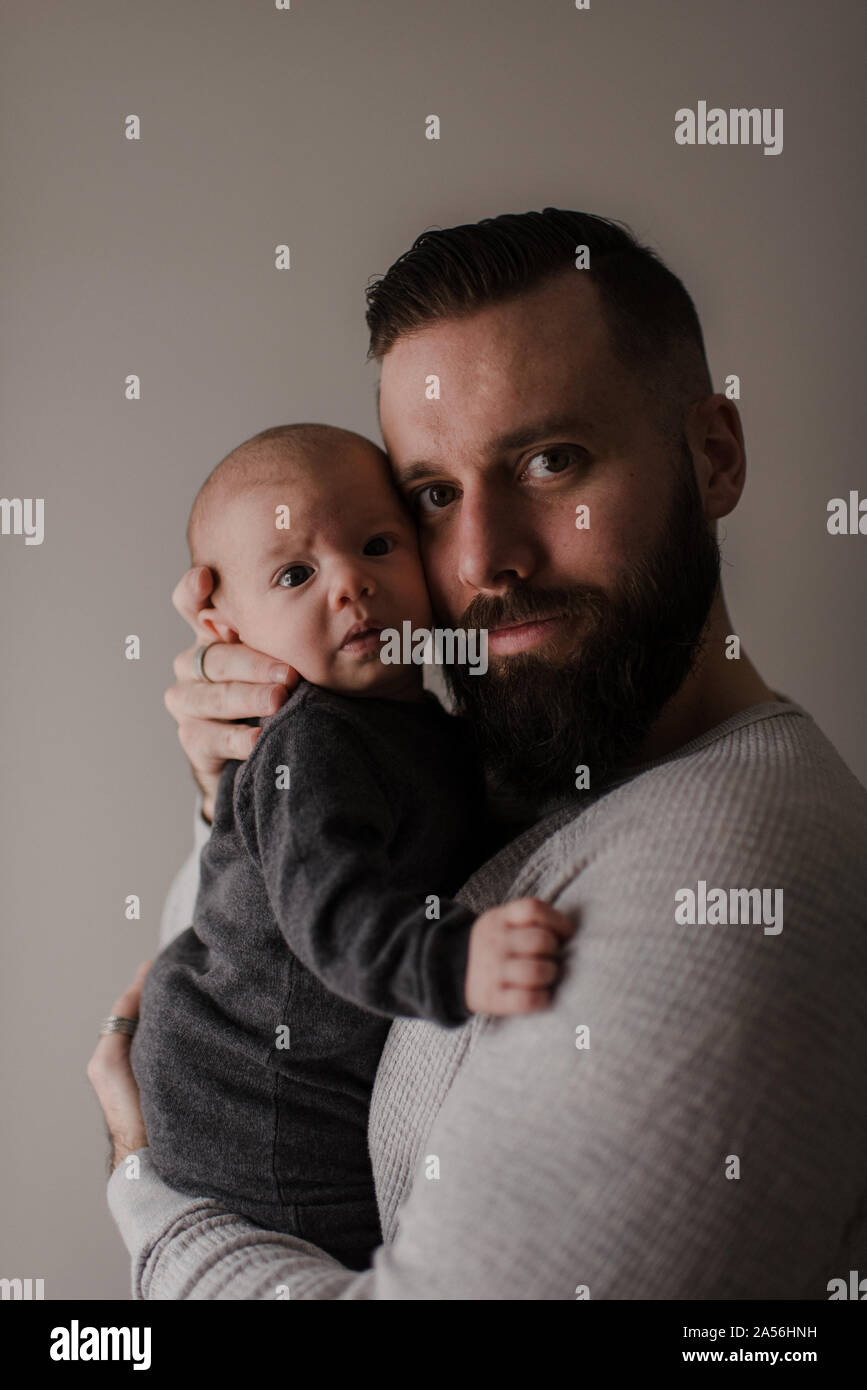 Man carrying baby hi-res stock photography and images - Alamy