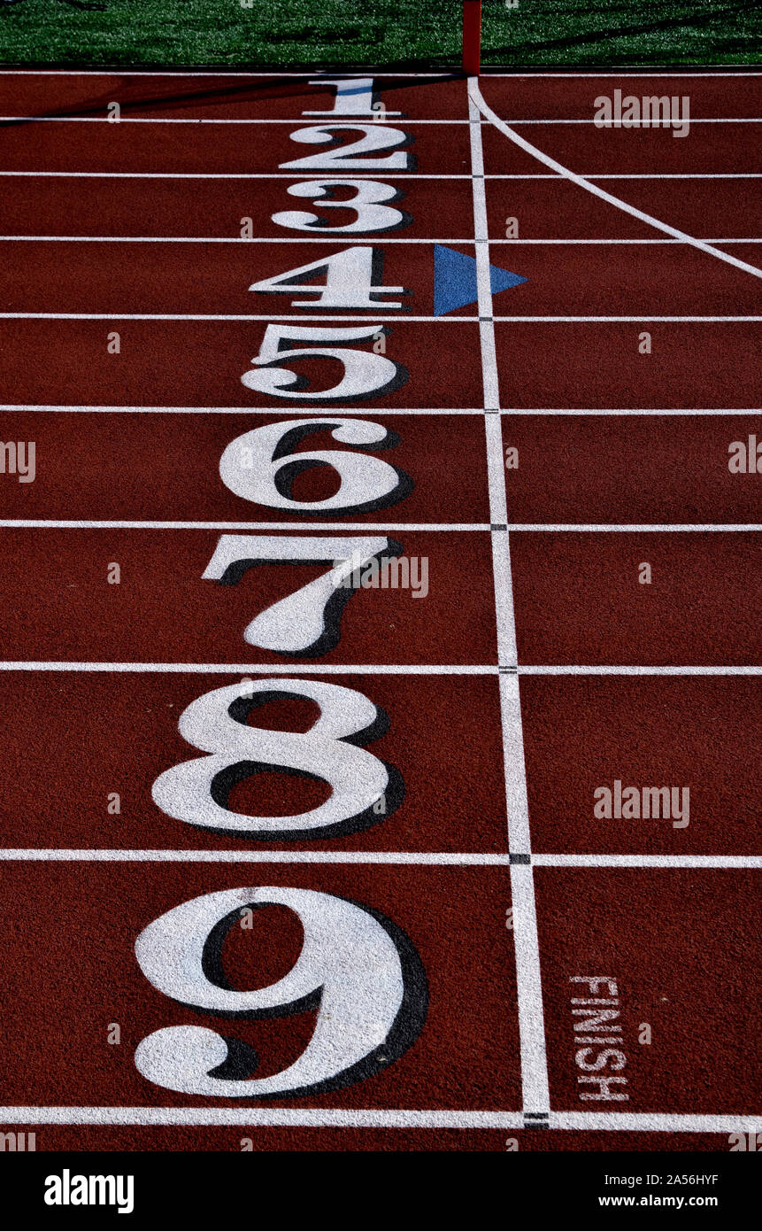 Track and field surface with numbers and orange color Stock Photo - Alamy