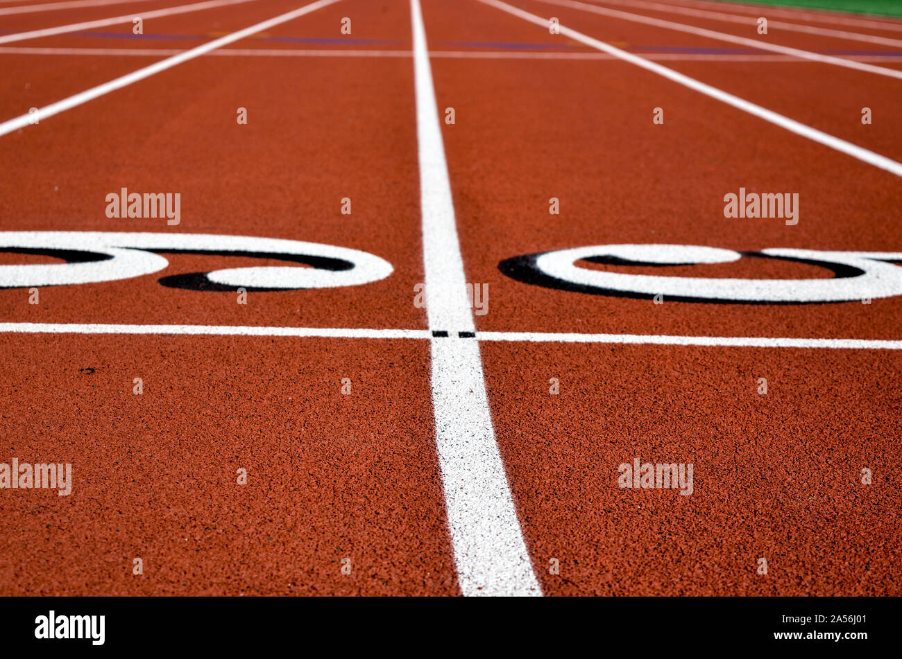 Track and field surface with numbers and orange color Stock Photo - Alamy