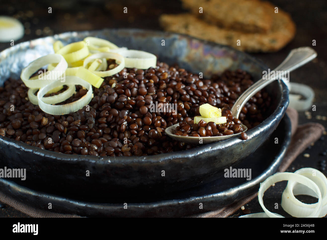 Black beluga lentils and vegetables stew close up Stock Photo - Alamy