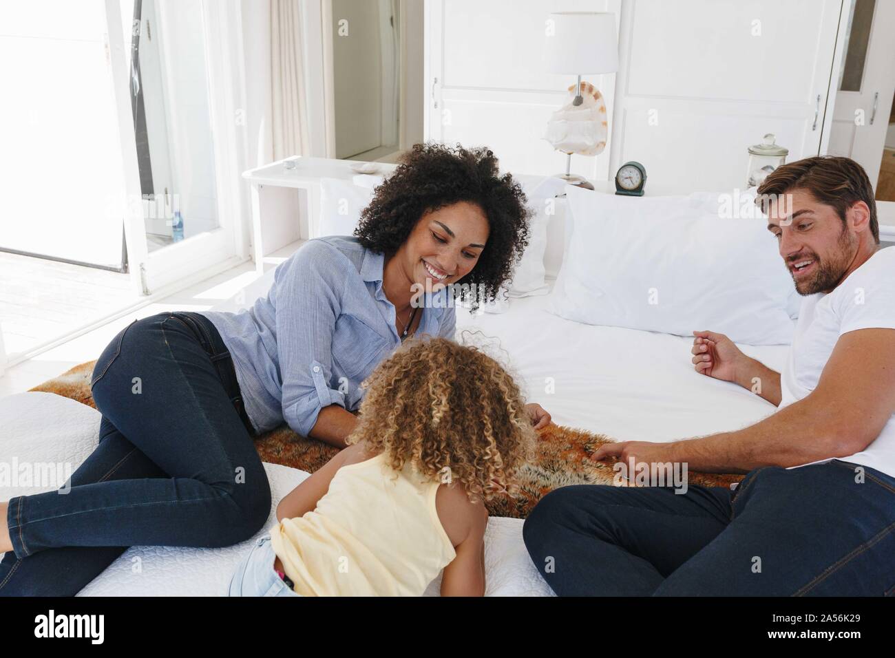 Family of three people sleeping in one bed hi-res stock photography and ...