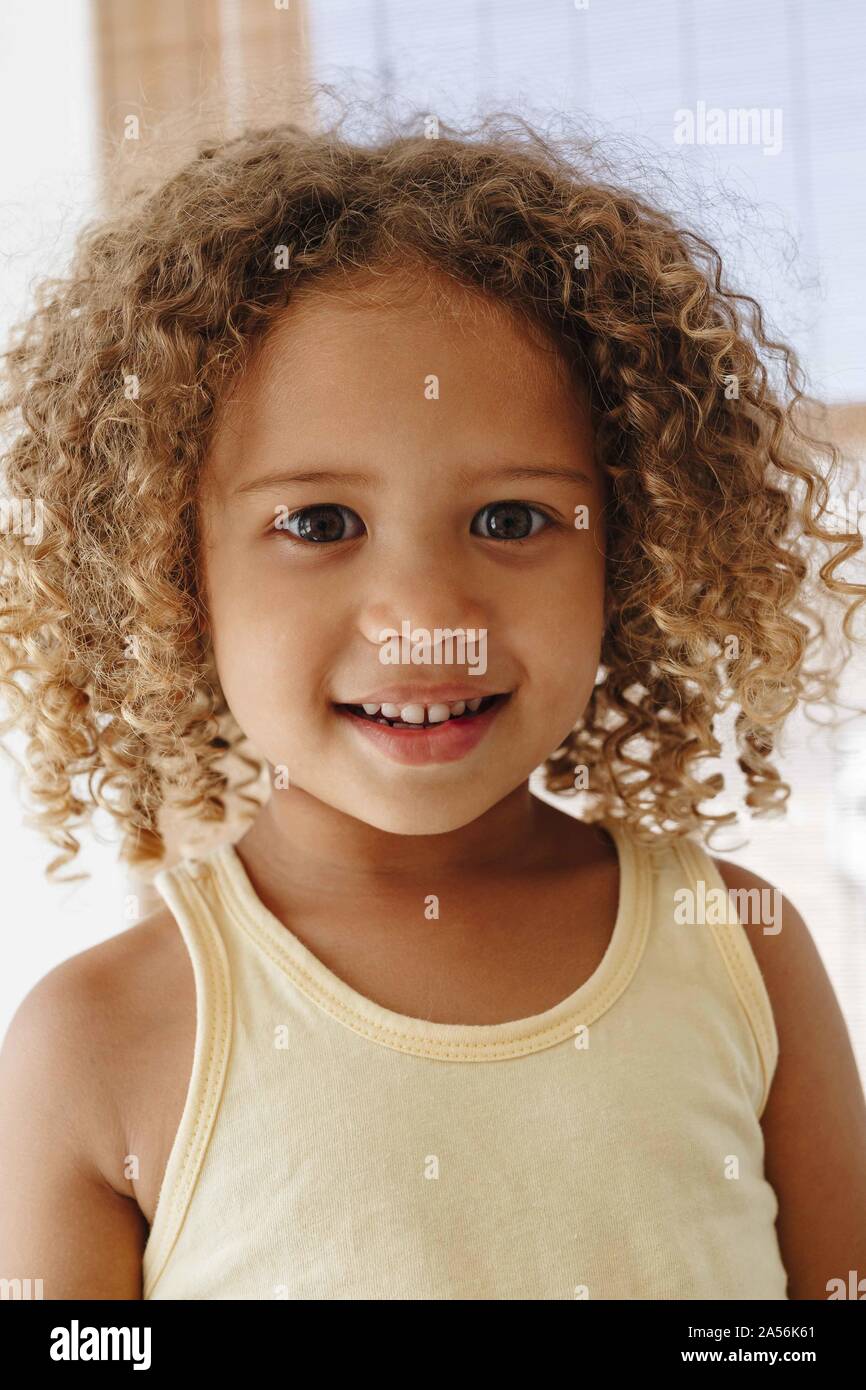 Portrait of little girl with afro hair Stock Photo - Alamy