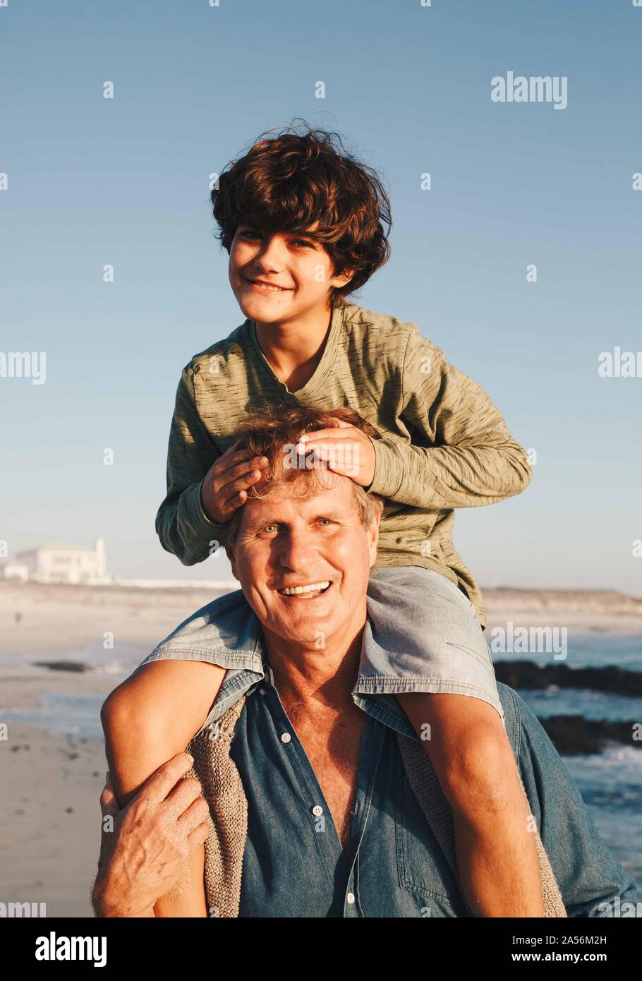 Child on piggyback hi-res stock photography and images - Alamy