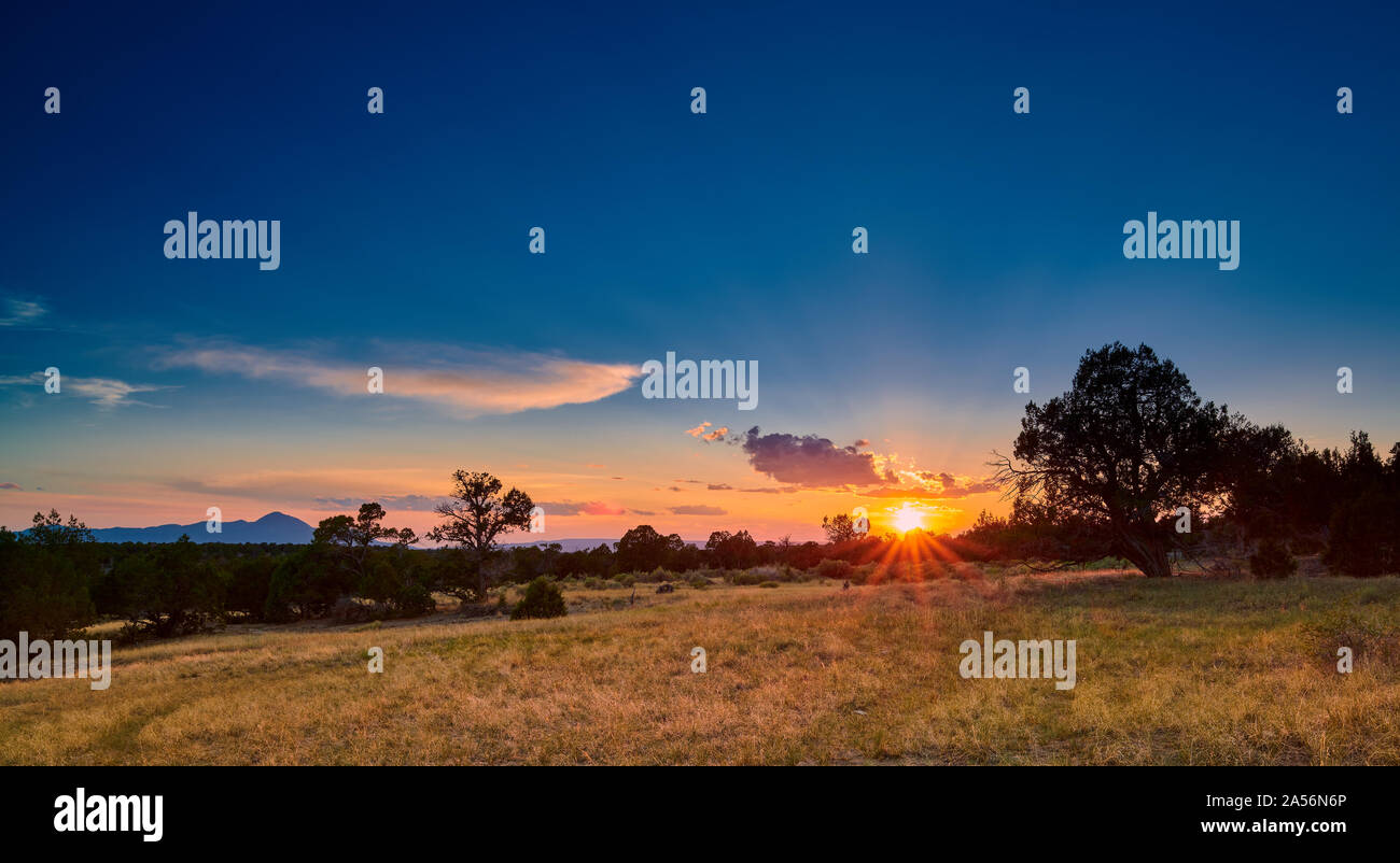 Sunset Over Open Field Stock Photo - Alamy