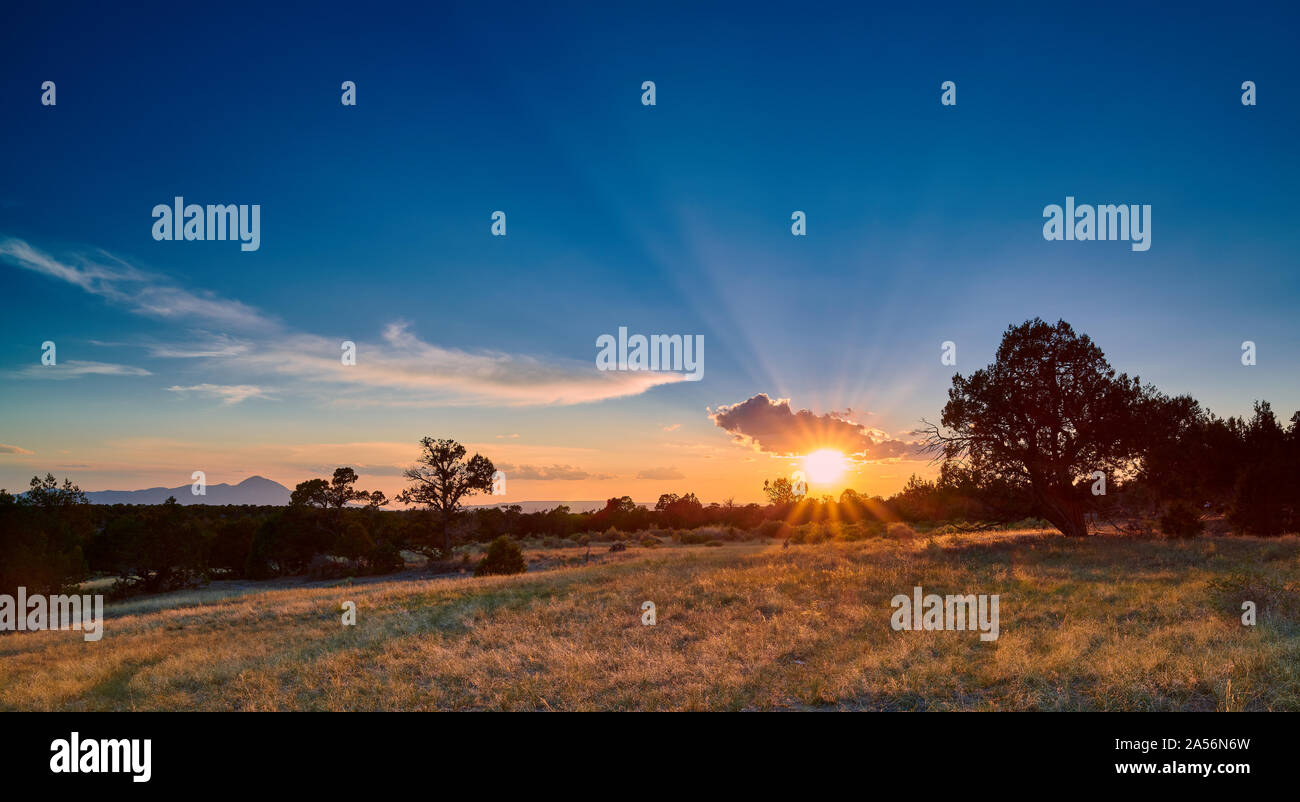 Sunset Over Open Field Stock Photo - Alamy