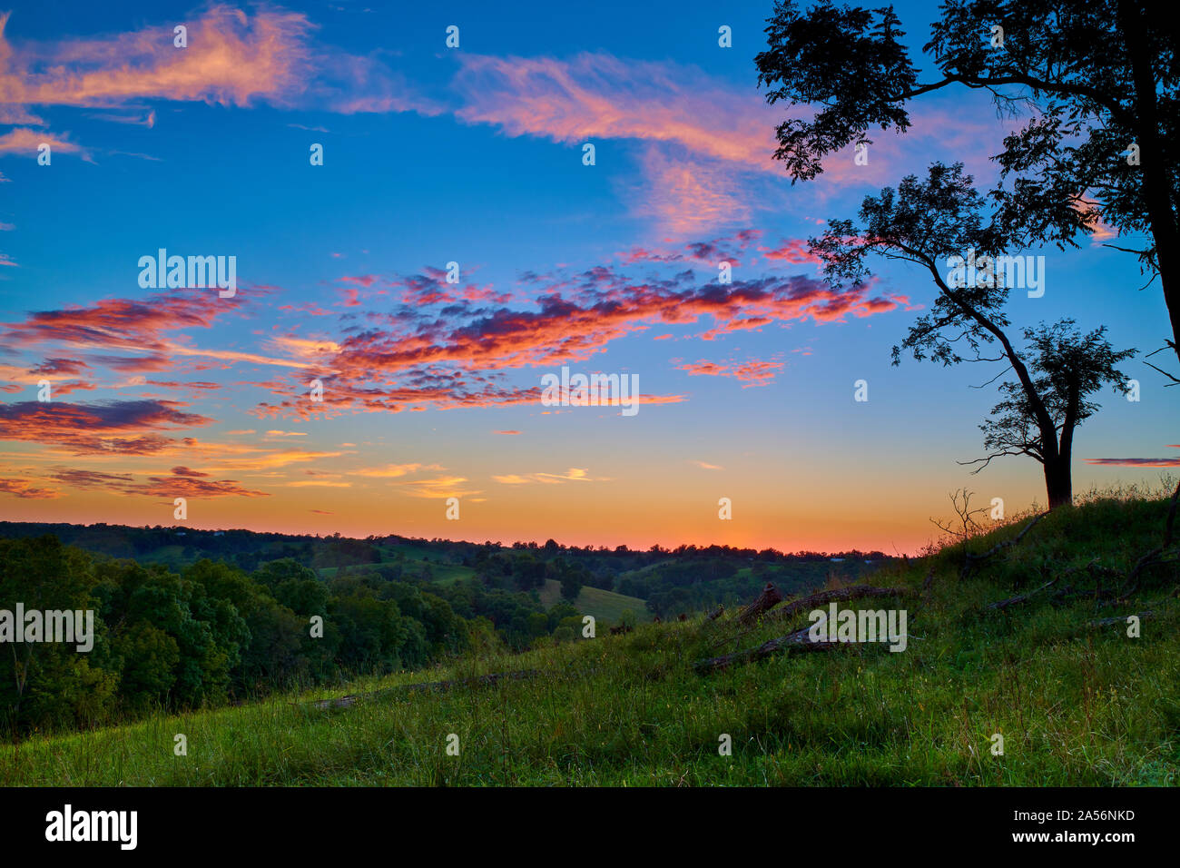 Sunset Over an Open Field Stock Photo - Alamy