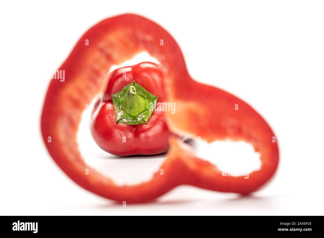 Group of one whole one slice of sweet red bell pepper back focus ...