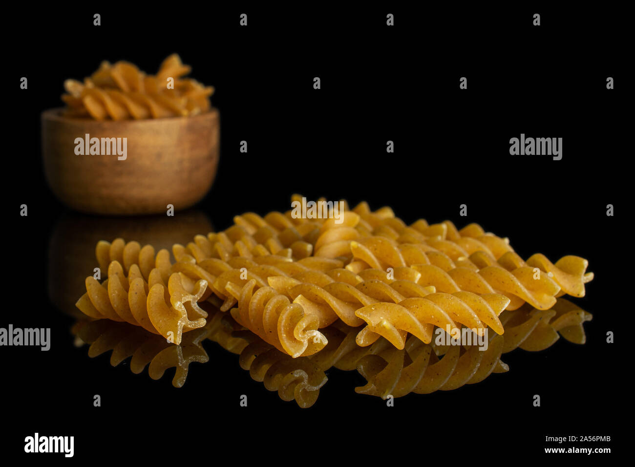 Lot of whole dry brown wholegrain fusilli large group is in the front ...