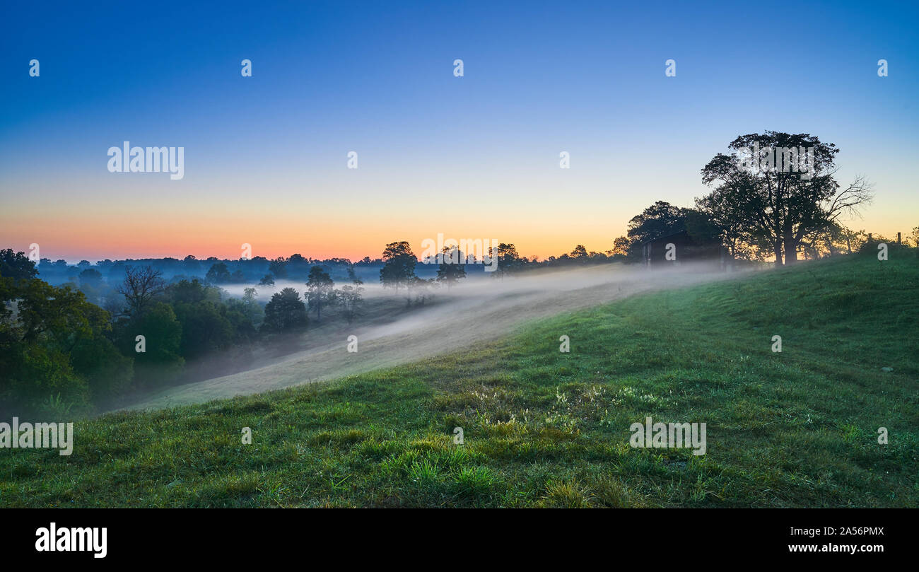 Farm at Dawn with Fog Stock Photo - Alamy