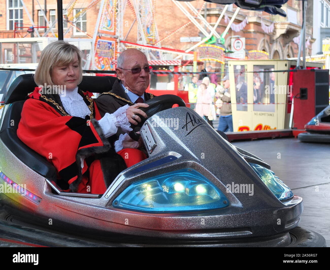 Dignitaries ride the dodgems at Ilkeston Charter Fair. It is one of the ...