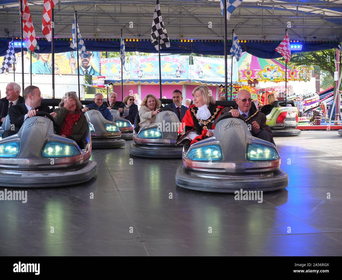 Dignitaries ride the dodgems at Ilkeston Charter Fair. It is one of the ...