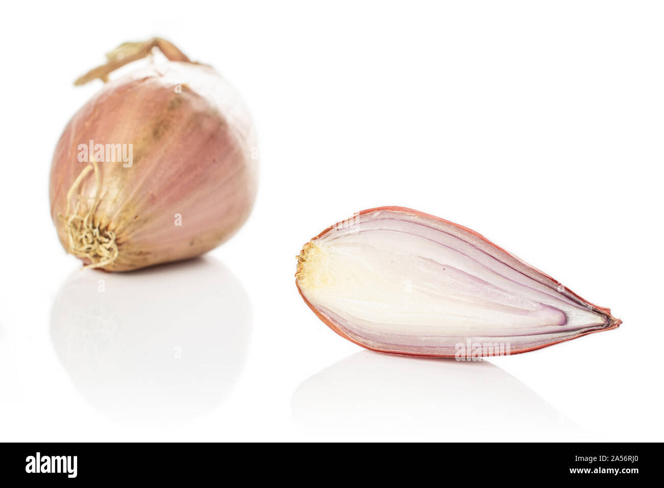 Group of one whole one half of fresh brown shallot isolated on white ...