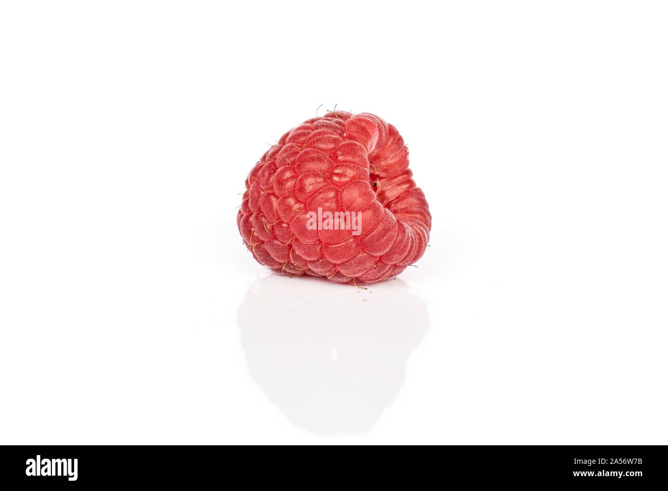 One whole fresh red raspberry isolated on white background Stock Photo ...