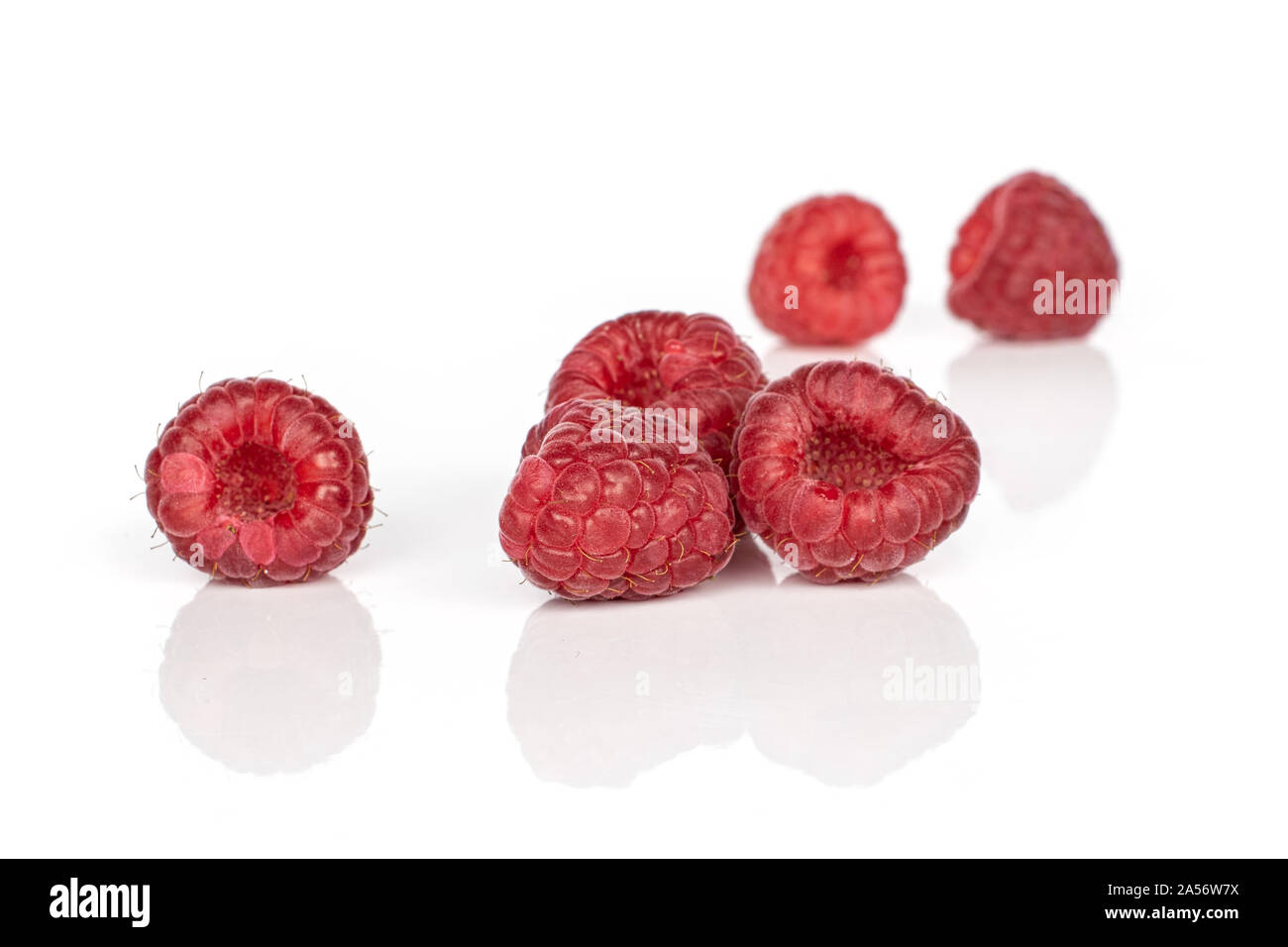 Group of six whole fresh red raspberry isolated on white background ...