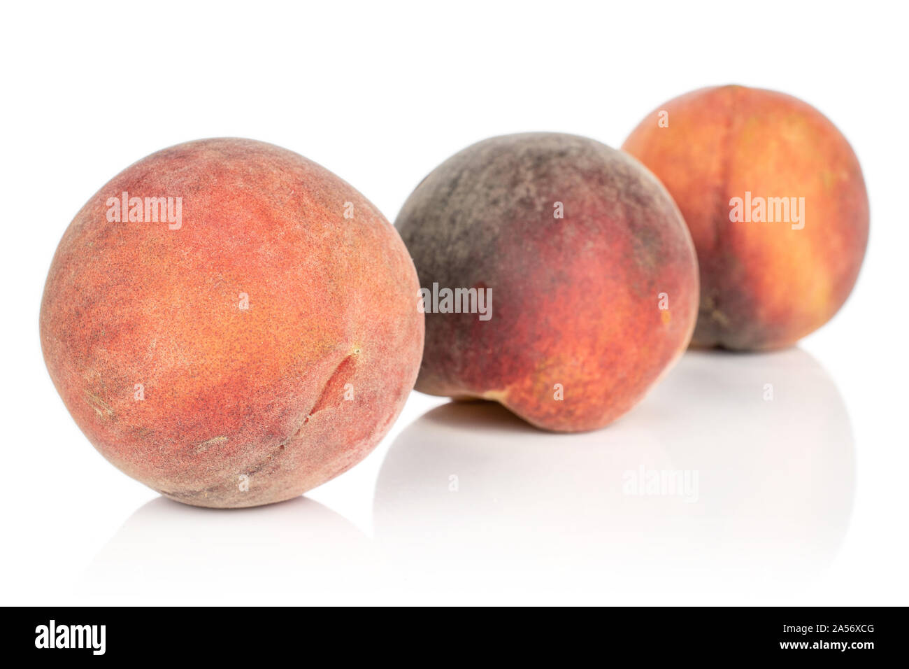 Group of three whole sweet red peach isolated on white background Stock ...