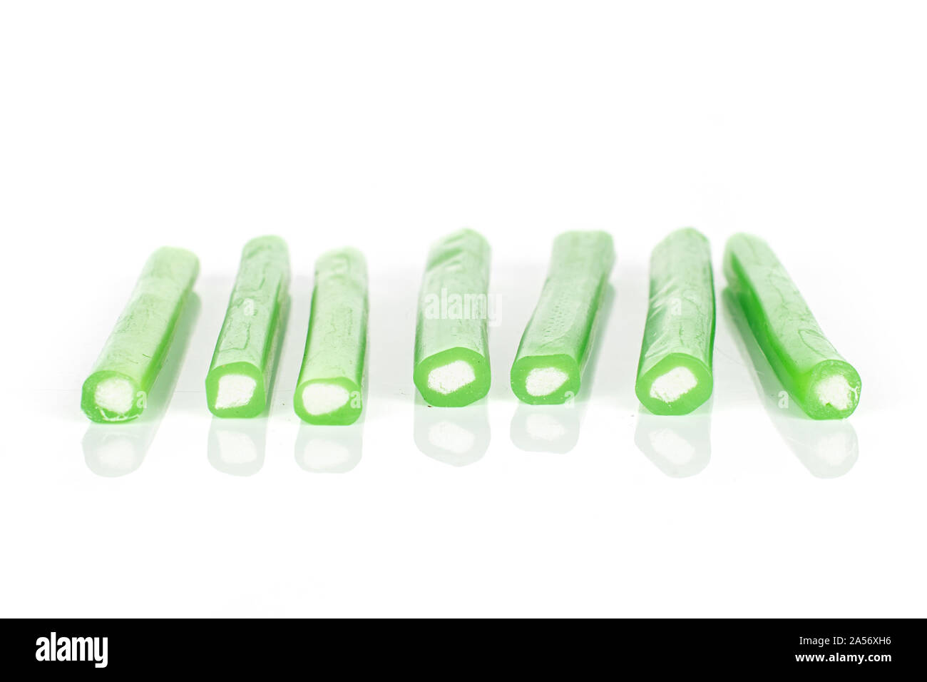 Group of seven whole sweet stick candy isolated on white background ...
