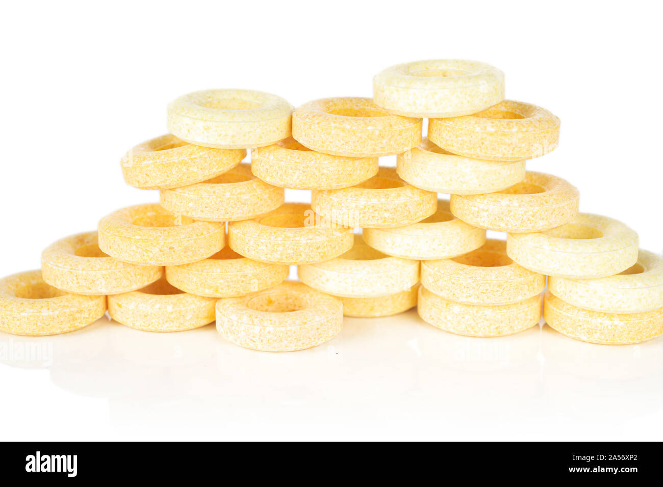 Lot of whole round pale yellow candy isolated on white background Stock ...