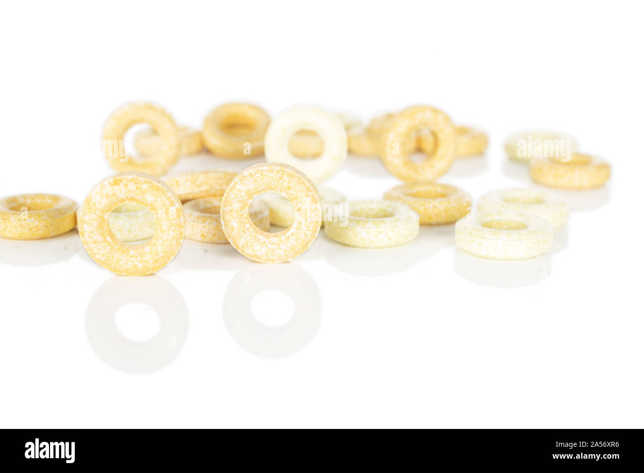 Lot of whole round pale yellow candy heap isolated on white background ...