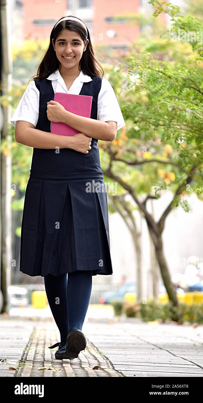 School Girl Student Walking On Sidewalk Stock Photo - Alamy
