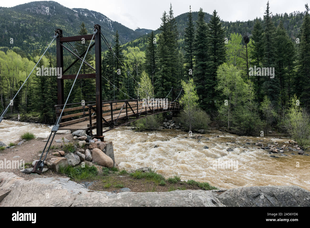 View of the rushing Animas River beneath a foot bridge near the route ...