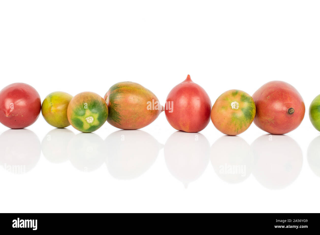 Group of seven whole fresh tomato de barao isolated on white background ...