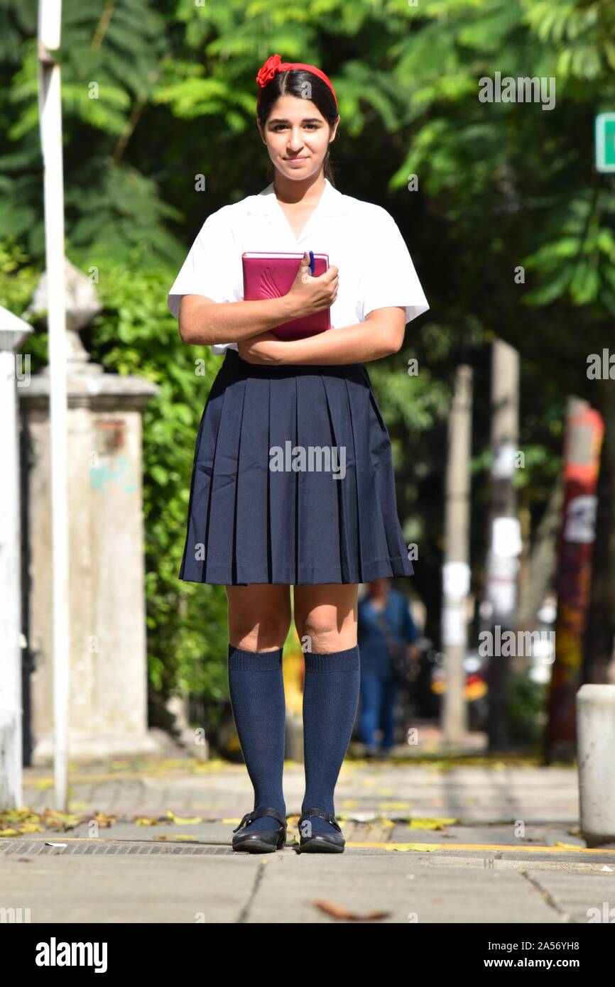Female Student Standing On Sidewalk Stock Photo - Alamy