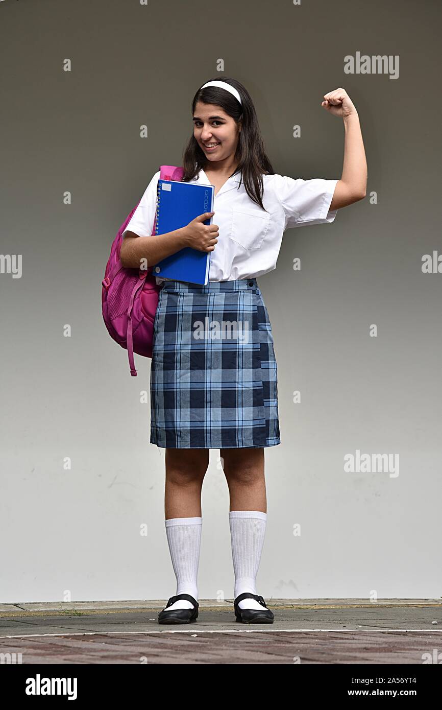 Teen School Girl Flexing Her Bicep Muscle Stock Photo - Alamy