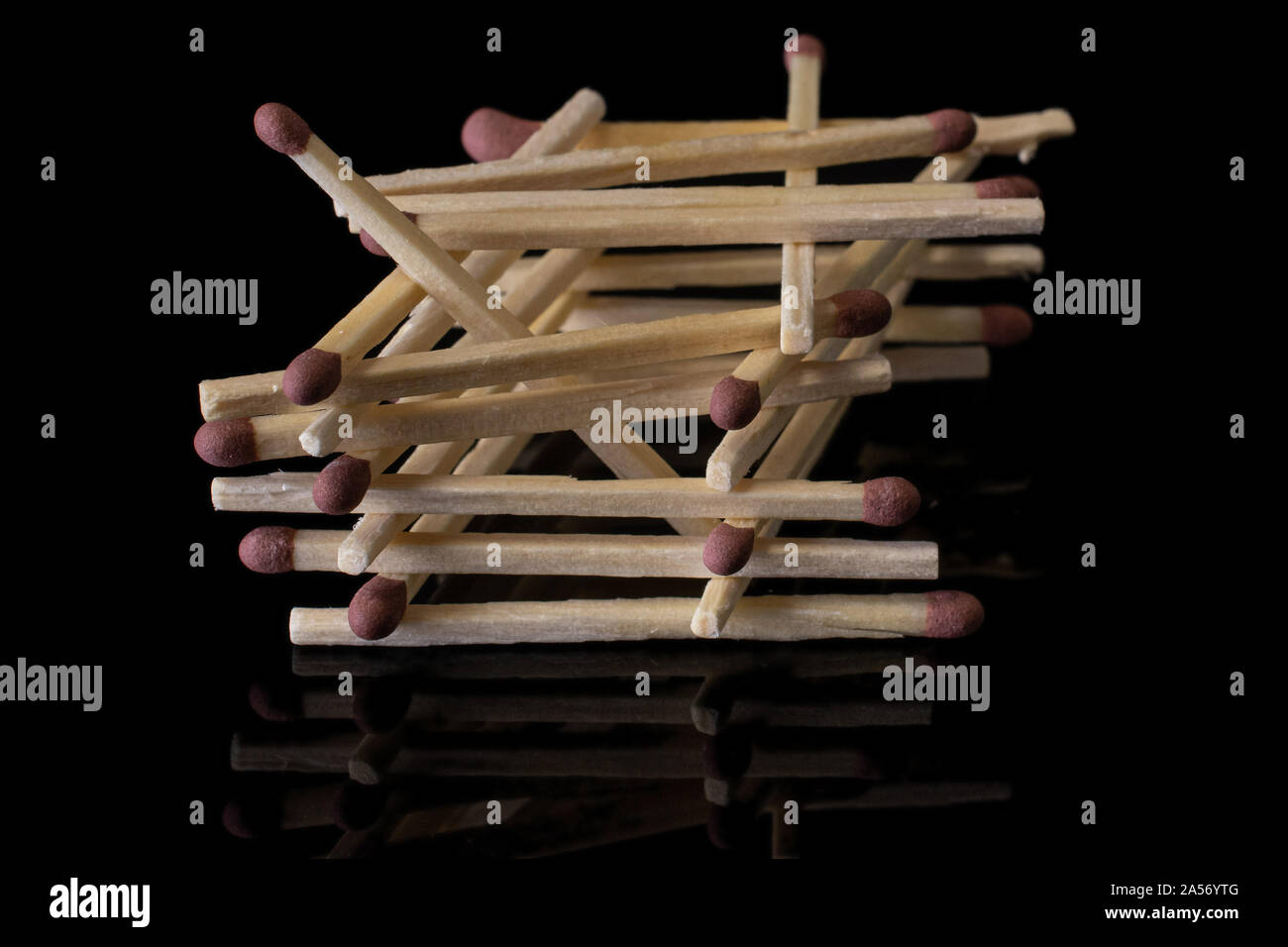 Lot of whole brown safety match tower isolated on black glass Stock ...